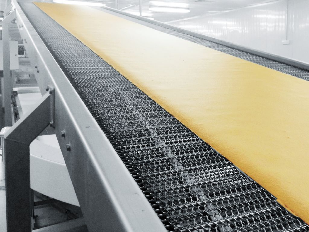 Meincke OCC Overhead Cooling Conveyor and Turning Drum | Bühler Group